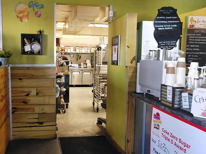 A glimpse behind the curtain reveals the organized chaos where all the magic happens. Even the kitchen walls maintain that signature lime-green.
