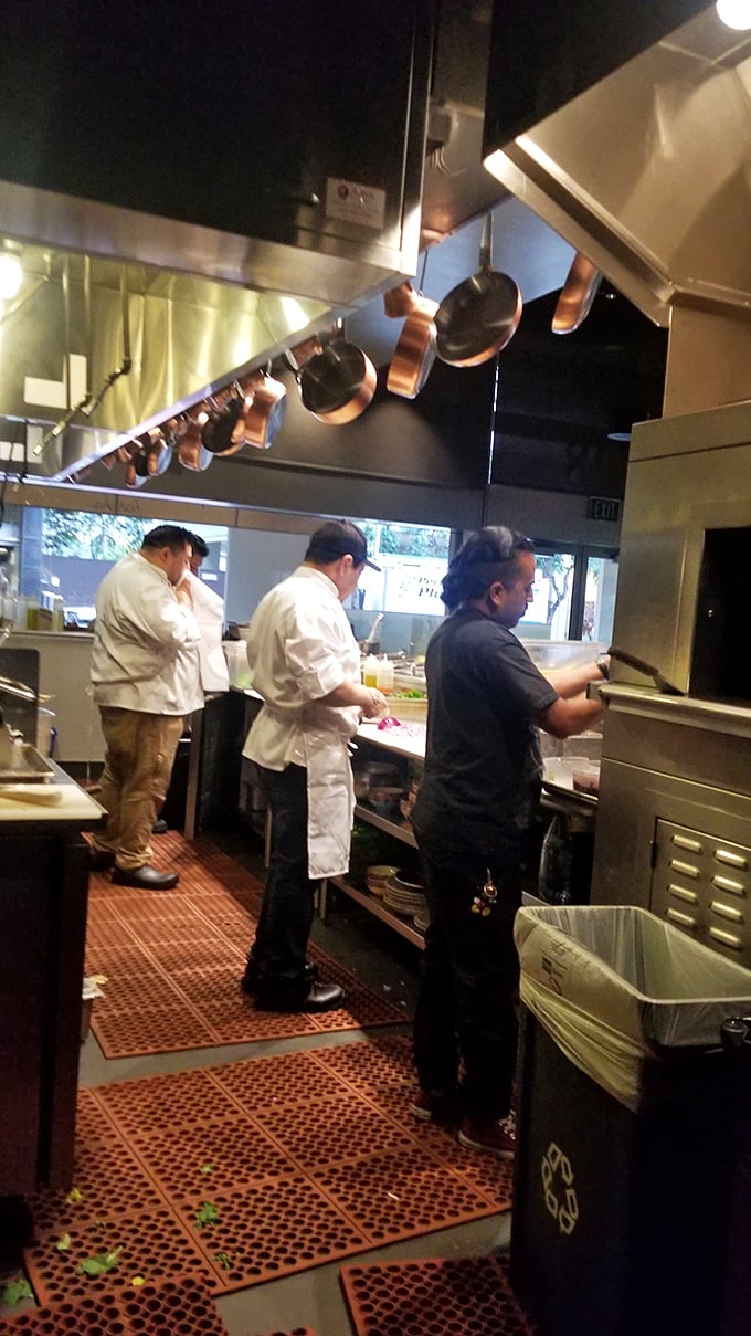 Behind the scenes magic&mdash;skilled cooks orchestrate the breakfast symphony with practiced efficiency, copper pots hanging overhead like culinary medals of honor.