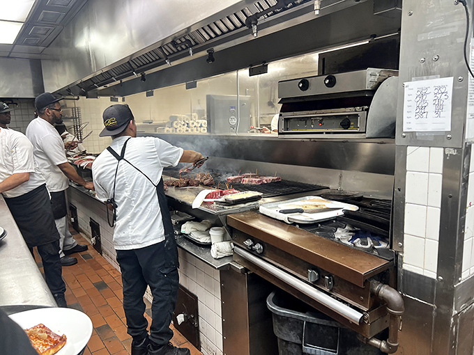 Behind the scenes, the kitchen's controlled chaos reveals where the magic happens. Those flames aren't for show &ndash; they're transforming prime beef into dreams.