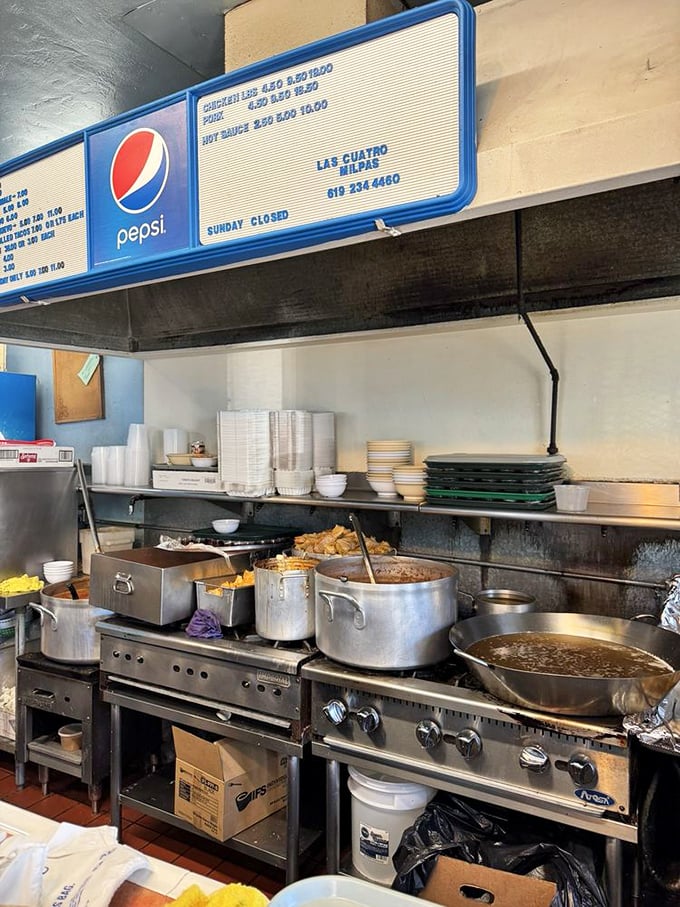Pots simmering with decades-old recipes, tended by cooks who measure with their hearts, not measuring cups. This kitchen tells the real story.
