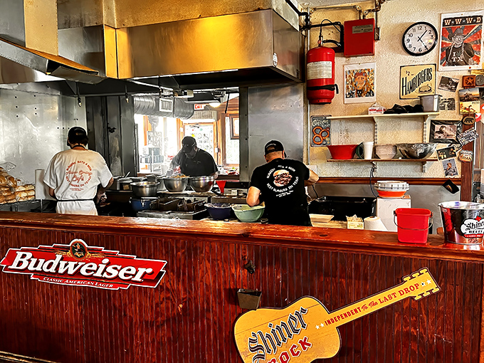 A glimpse into the compact kitchen where burger dreams become reality. No fancy equipment—just well-seasoned surfaces and well-practiced hands.