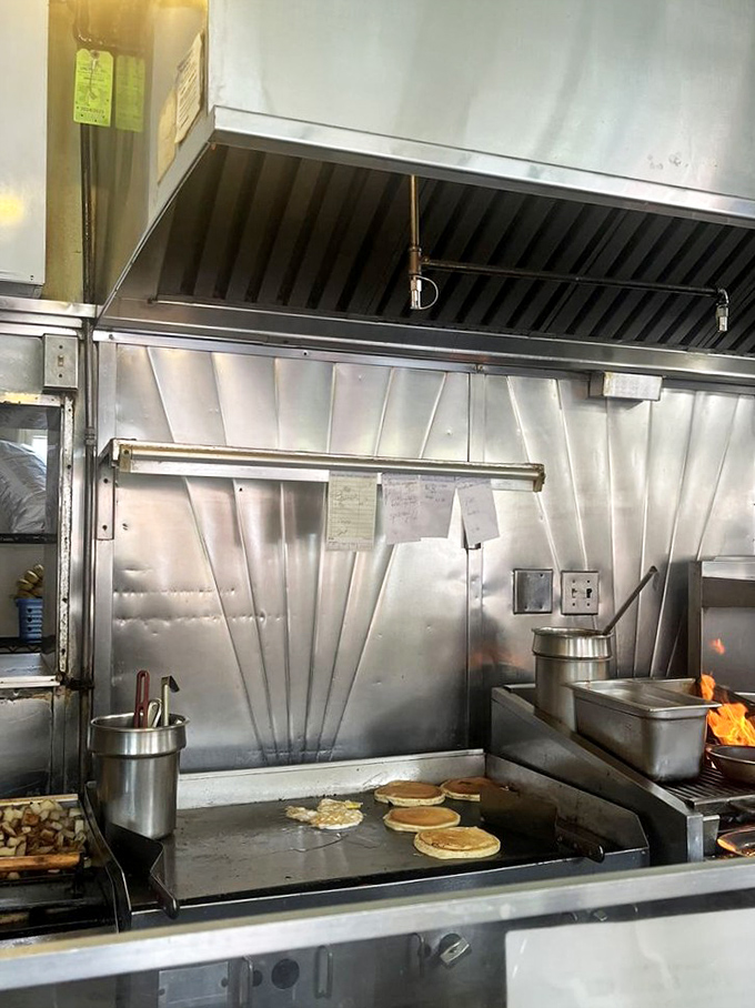 The kitchen ballet in full swing &ndash; pancakes flip while the griddle sizzles its morning symphony.