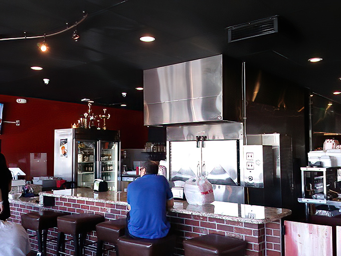 A glimpse behind the barbecue curtain where the magic happens. That brick counter separates mere mortals from the keepers of the flame.