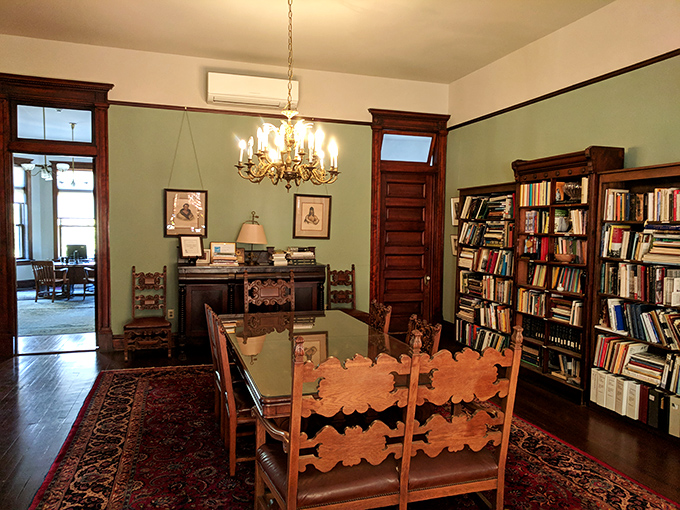 The library exudes scholarly charm with floor-to-ceiling bookshelves and rich wood tones. I half-expected to find Sherlock Holmes smoking a pipe in the corner.