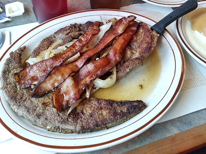Liver and onions&mdash;the dish that separates the culinary adventurers from the tourists. Topped with bacon because Pennsylvania knows how to improve perfection.