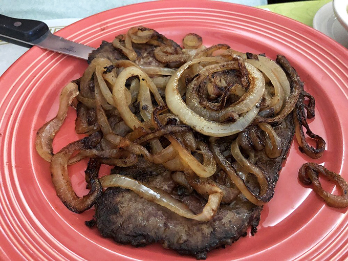 Liver and onions done right, converting even the most skeptical diners into unexpected fans of this classic.