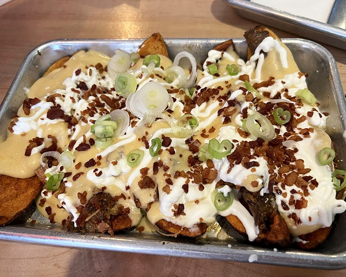 Loaded potato skins that make you question why you've wasted years eating lesser versions. The green onions aren't garnish&mdash;they're punctuation.