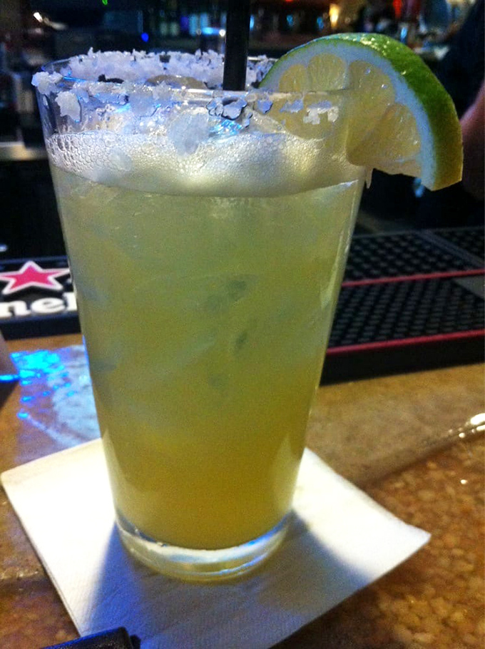 A proper margarita with salt-crusted rim and lime wedge&mdash;the kind that makes you contemplate canceling your afternoon plans in favor of ordering a second.