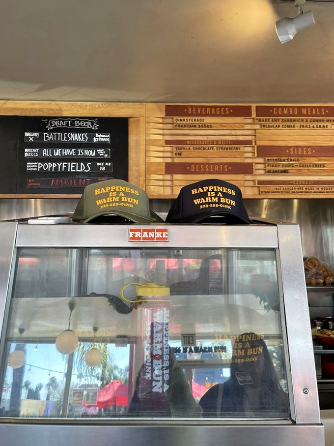 "Happiness is a warm bun" isn't just clever merch—it's the philosophy that makes The Oinkster a temple of comfort food worship.