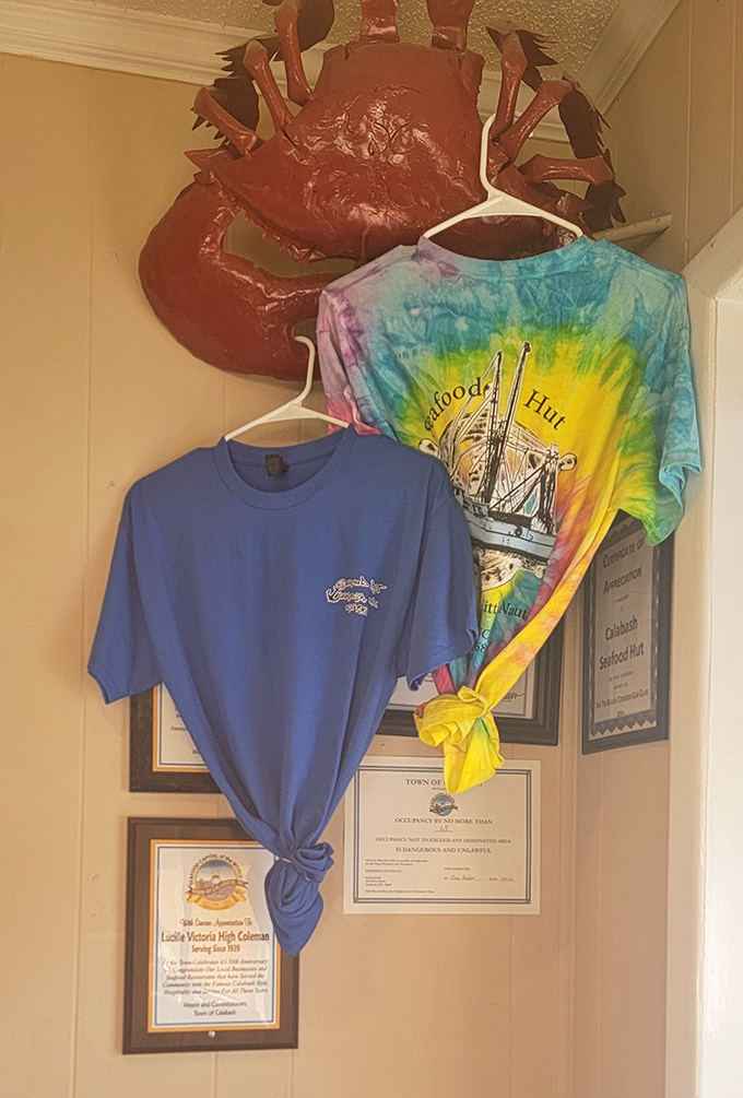 Souvenirs that say "I survived the seafood coma and all I got was this awesome t-shirt." That crab watching over everything has seen some things.