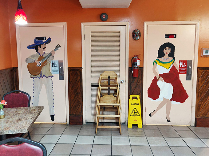 Bathroom doors transformed into works of art – a mariachi and dancer standing guard, adding whimsy to even the most practical spaces.