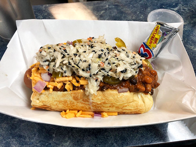 Layer upon layer of toppings create a skyscraper of flavor. This isn't just a hot dog&mdash;it's an architectural marvel for your mouth.