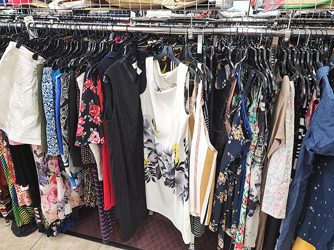 The dress rack reveals a kaleidoscope of patterns and styles spanning decades&mdash;fashion time travel that costs less than your morning latte.