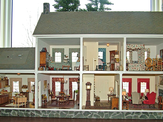 This colonial dollhouse offers more historical accuracy than most textbooks—right down to the tiny spinning wheel waiting for an equally tiny spinner.