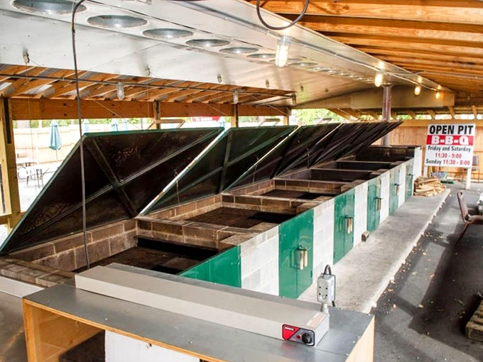 The open pit reveals where the real magic happens, transforming raw ingredients into smoky masterpieces through fire.