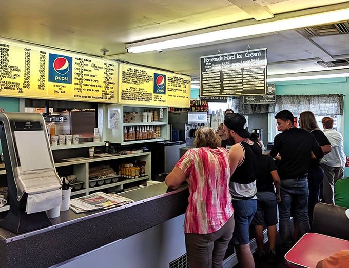 Locals and tourists alike line up at the counter, united in the universal language of "I'll have what they're having."