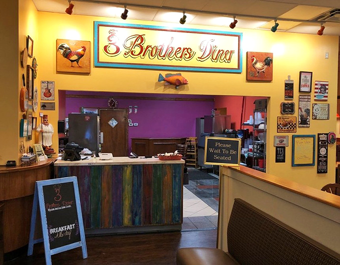 The colorful reception counter greets you with a rooster-themed welcome that says, "Yes, we take breakfast very seriously around here."