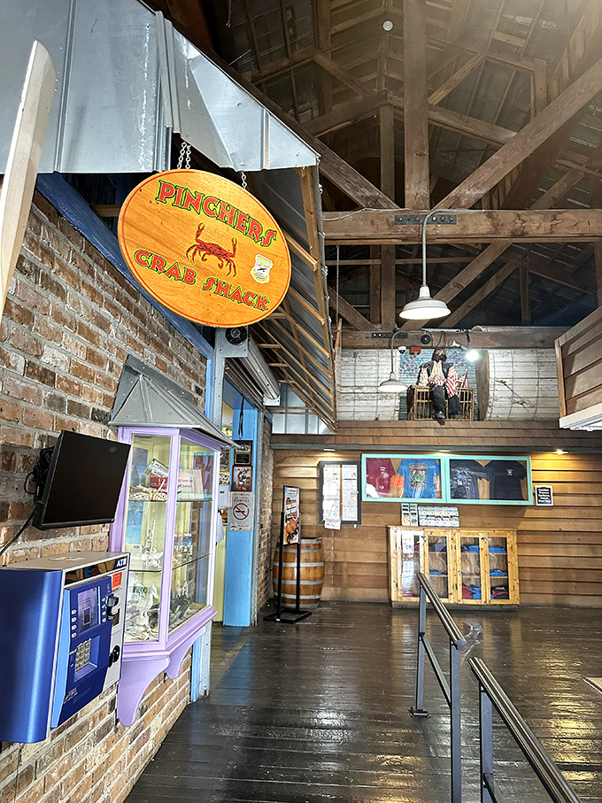 "Pinchers Crab Shack" isn't just a sign—it's a promise. The rustic interior with exposed beams feels like the inside of a luxurious ship's hull.