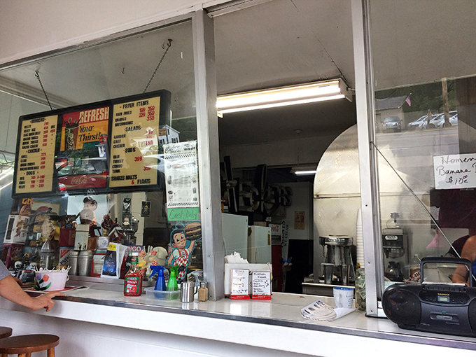 The ordering window&mdash;a portal to happiness where dreams of perfectly fried delights come true. Place your order and prepare for joy.