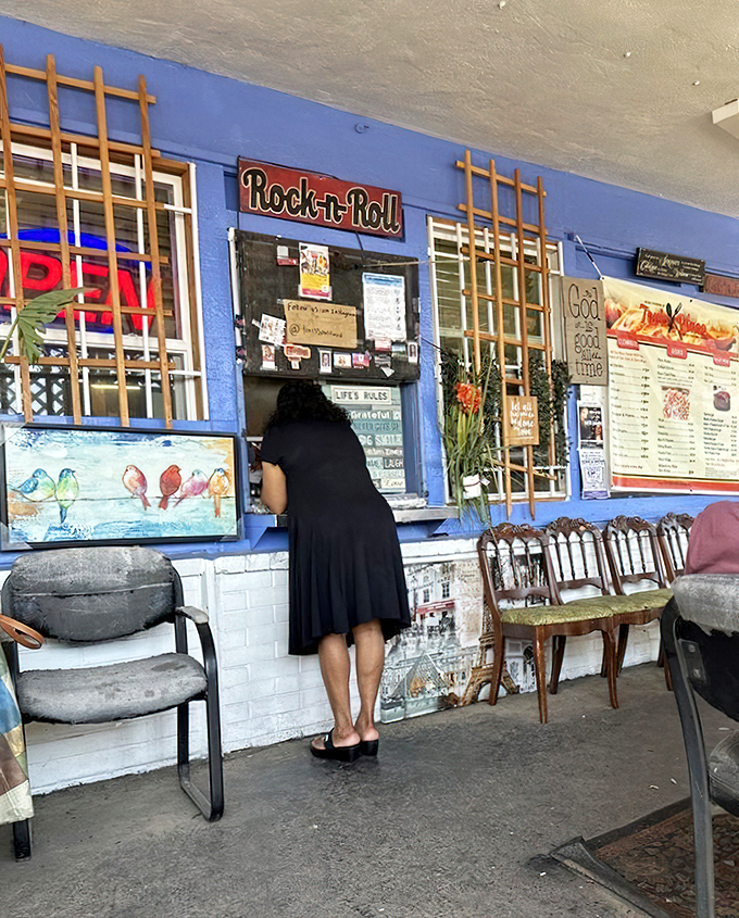 The ordering window—that magical portal where dreams are placed and soul food treasures emerge. Notice the "Rock-n-Roll" sign, because this place definitely rocks.