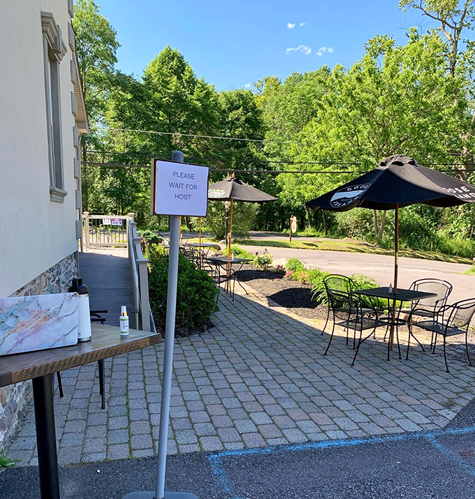 Outdoor seating that whispers, "Stay awhile." Even the 'Please Wait' sign seems more like a gentle suggestion than a command.
