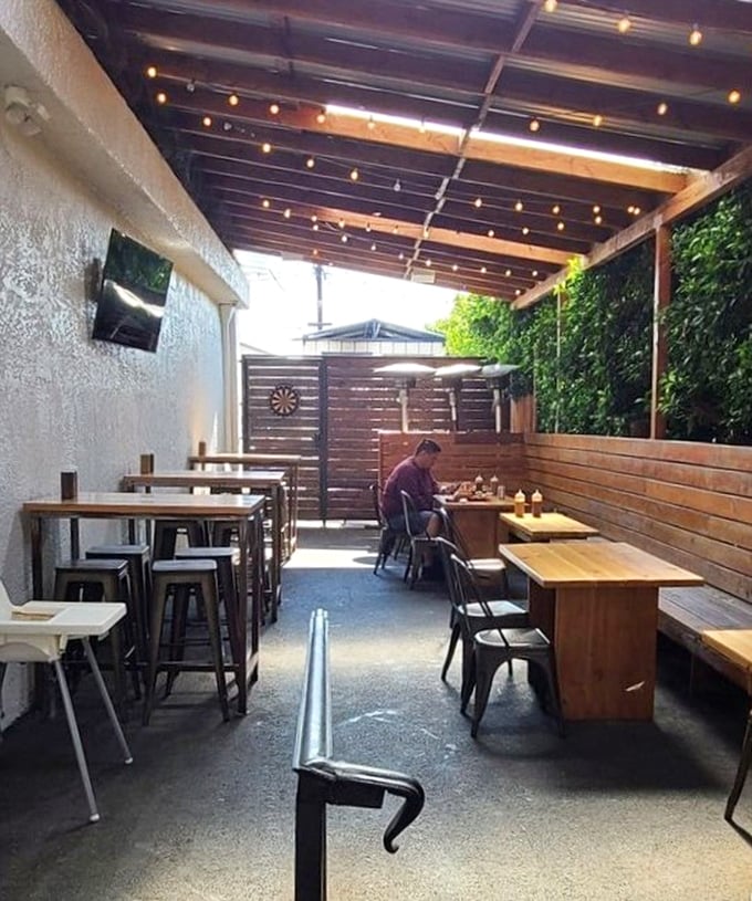 The outdoor patio&mdash;where fresh air meets fresh barbecue. A wooden sanctuary for serious eating without judgment.