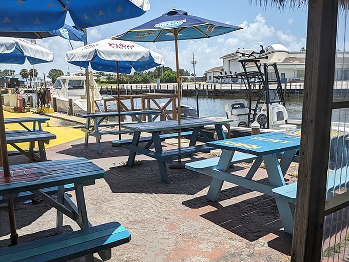 Waterfront dining where boats pull up like it's a seafood drive-thru. Those picnic tables have witnessed more food euphoria than a cooking show.