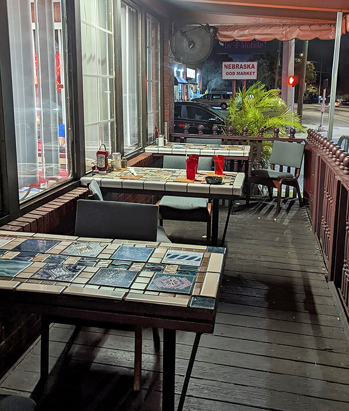 The outdoor patio offers a glimpse of Nebraska Avenue life&mdash;mosaic tabletops add artistic flair to your morning coffee ritual.