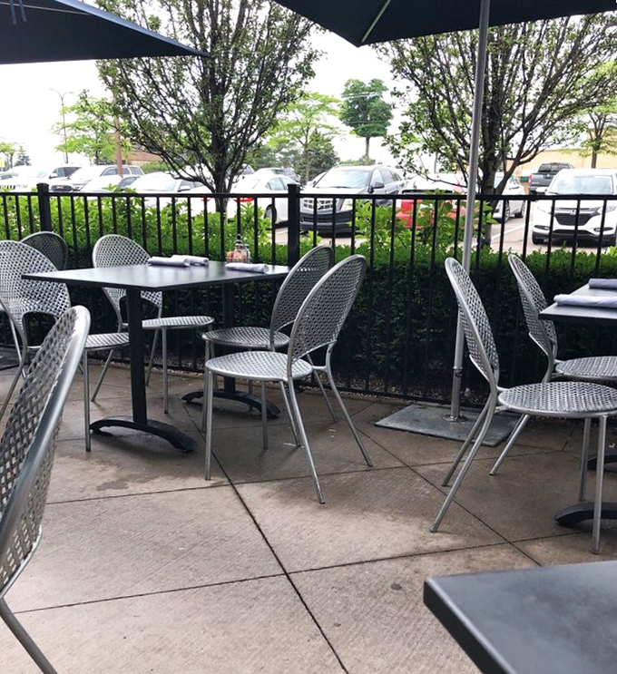 Al fresco dining, Michigan-style &ndash; where summer breezes complement every bite and parking lot views come standard.