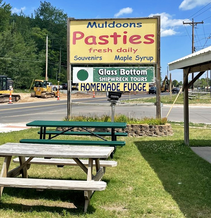 Picnic tables await beneath the famous Muldoons sign &ndash; because sometimes pasties taste even better in the fresh Michigan air with a view of passing traffic.