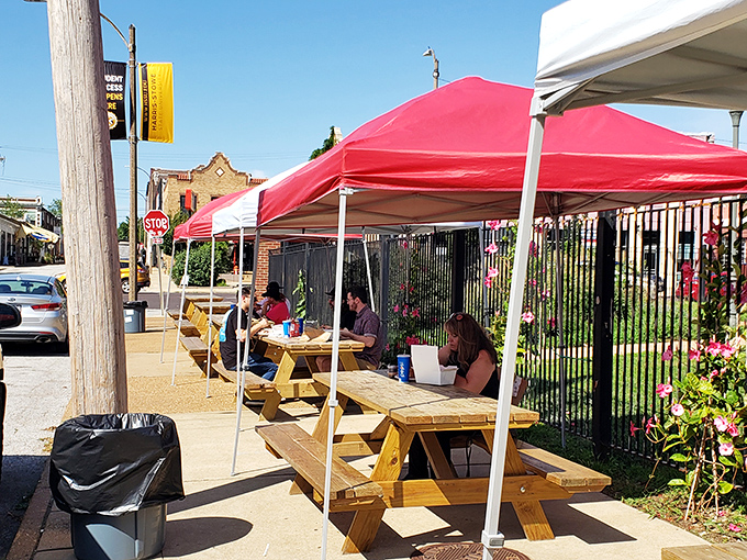 Outdoor seating under red tents&mdash;where summer breezes carry the scent of smoke and the promise of meat-induced happiness.