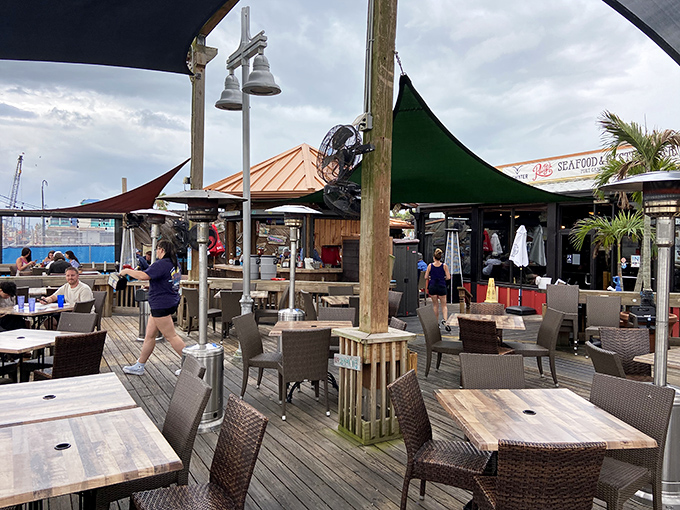 The outdoor deck—where sea breezes enhance flavor and every meal comes with a side of vitamin D and harbor views.
