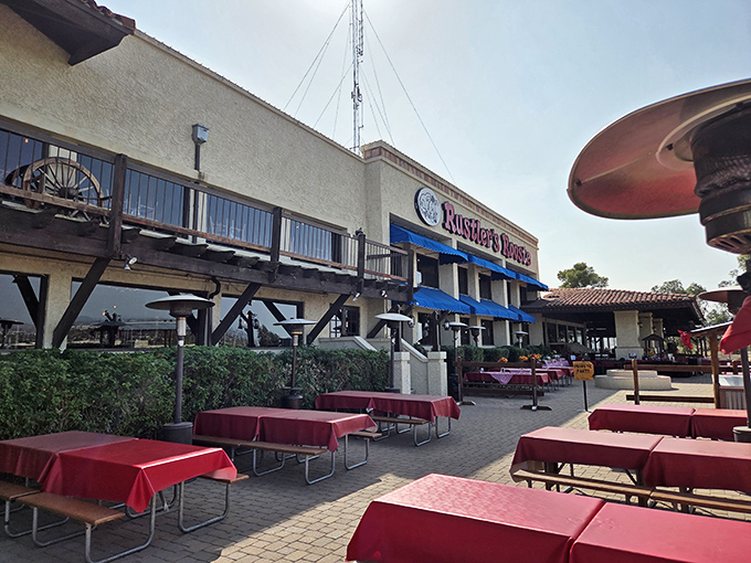 Outdoor seating with red tablecloths overlooking Phoenix&mdash;dining with a view that rivals any fancy steakhouse.
