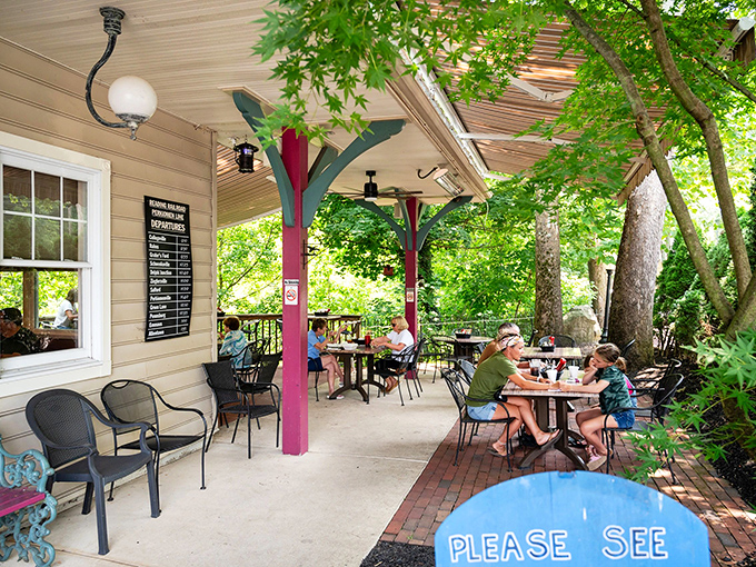 Outdoor seating nestled under leafy trees offers the perfect setting for savoring a cheesesteak while soaking up Pennsylvania sunshine.