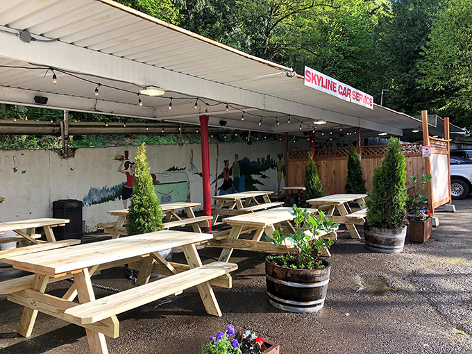 Skyline's outdoor seating area proves that picnic tables under string lights create the perfect backdrop for summer evening burger indulgence.