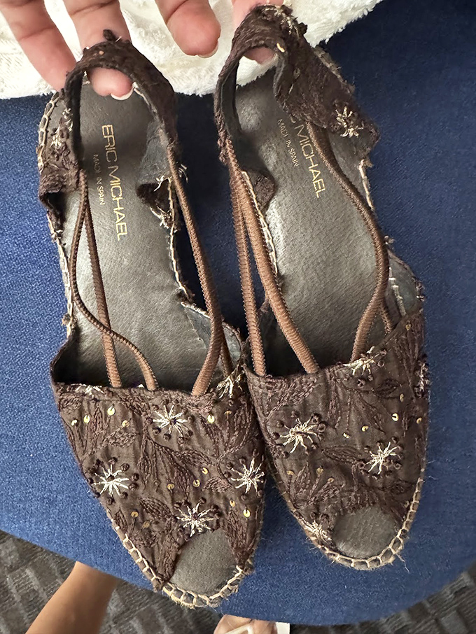 These intricately detailed Eric Michael sandals tell tales of craftsmanship and style. Someone's "no longer sparking joy" becomes your wardrobe's new best friend.