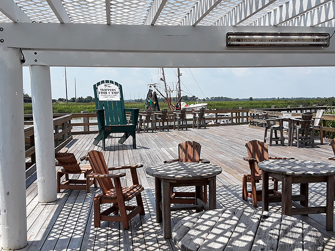 The deck isn't just outdoor seating&mdash;it's front-row tickets to nature's best show, with marsh grass and water views included.