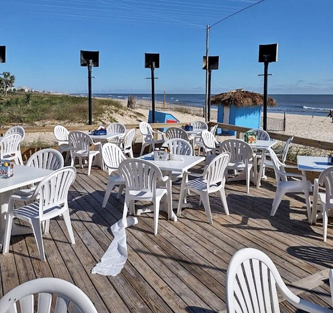 Oceanfront dining without the white tablecloth markup&mdash;just honest wooden decks, plastic chairs, and million-dollar Gulf views.