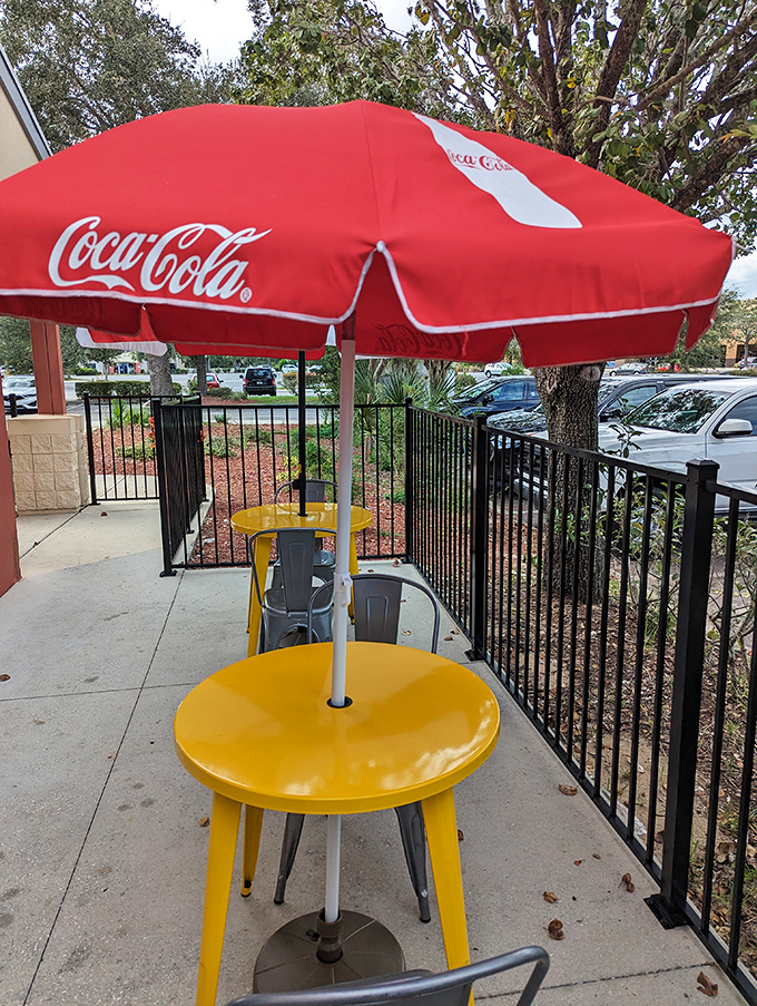Even the patio seating comes with that classic Coca-Cola umbrella charm of authentic American dining.