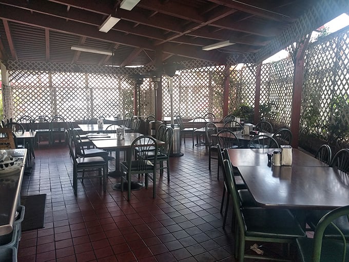 The patio area offers a breezy alternative to indoor dining&mdash;latticed walls creating dappled light perfect for lingering over that last bite.