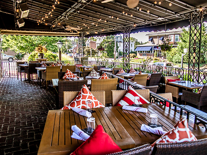 Outdoor seating that feels like dining in a secret garden – complete with colorful pillows that pop like exclamation points.