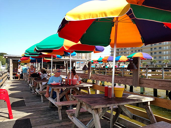 Colorful umbrellas providing shade while you feast on some of the freshest seafood this side of paradise.