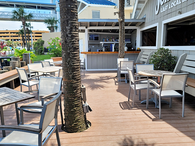 The outdoor deck &ndash; where salt air seasons every bite, palm trees provide natural shade, and the Gulf of Mexico serves as the ultimate dining backdrop.