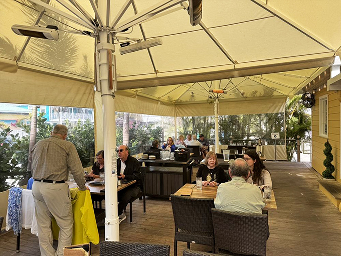 Outdoor dining under Florida skies is practically mandatory. This covered patio offers the perfect compromise between "natural setting" and "not melting in the sun."