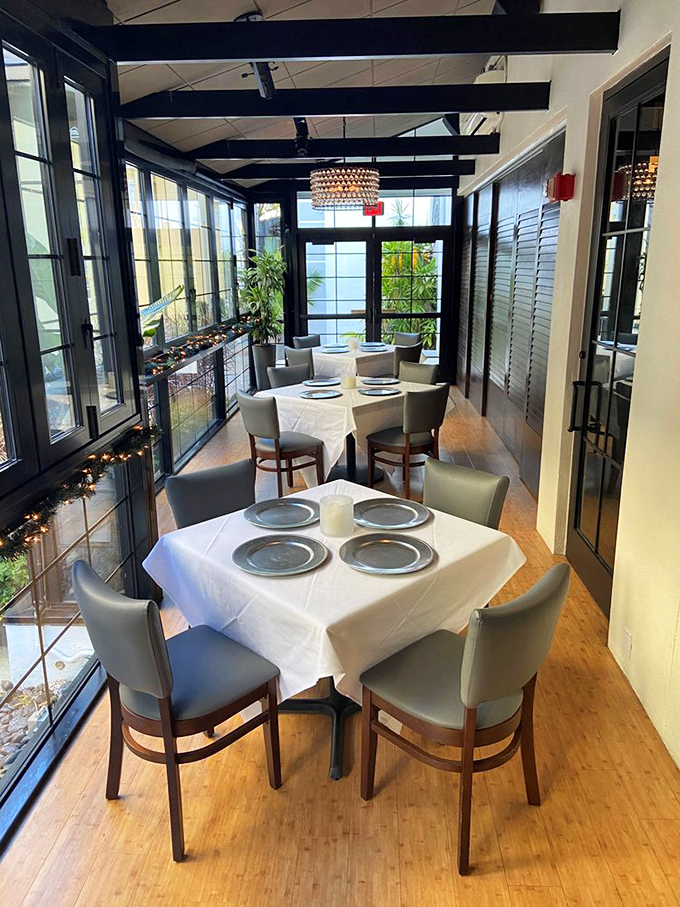 This sunroom dining area captures Florida's light without its heat—a greenhouse for growing perfect dining memories instead of plants.