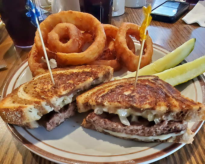 The patty melt: that brilliant invention where burger meets grilled cheese in a harmonious union. Those onion rings are the perfect wedding guests.