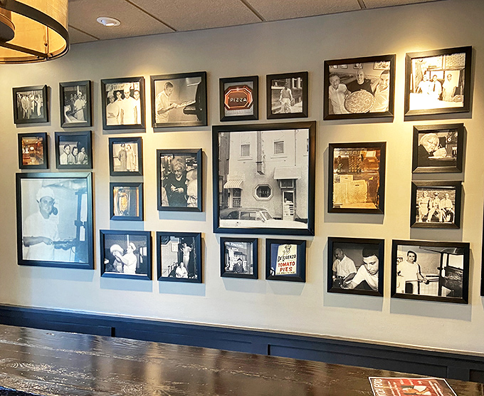 A wall of history in black and white frames. Each photo whispers, "We've been making people happy for generations."