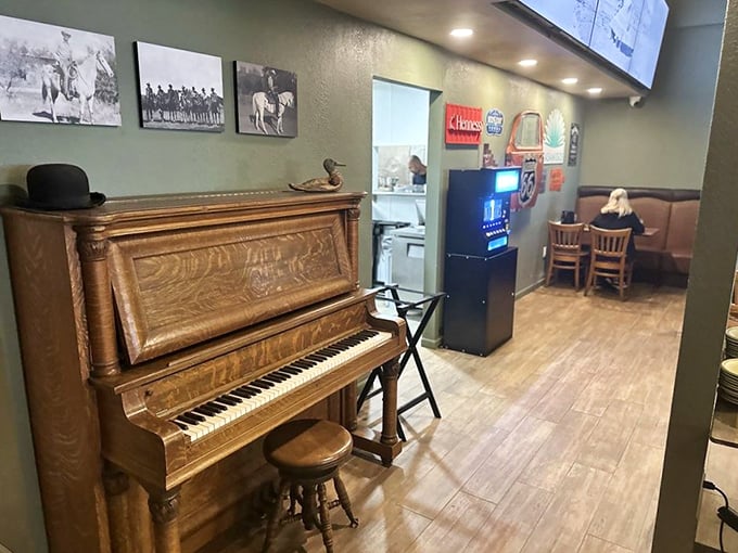An antique piano stands ready for impromptu performances, because nothing pairs better with great food than a side of unexpected joy.