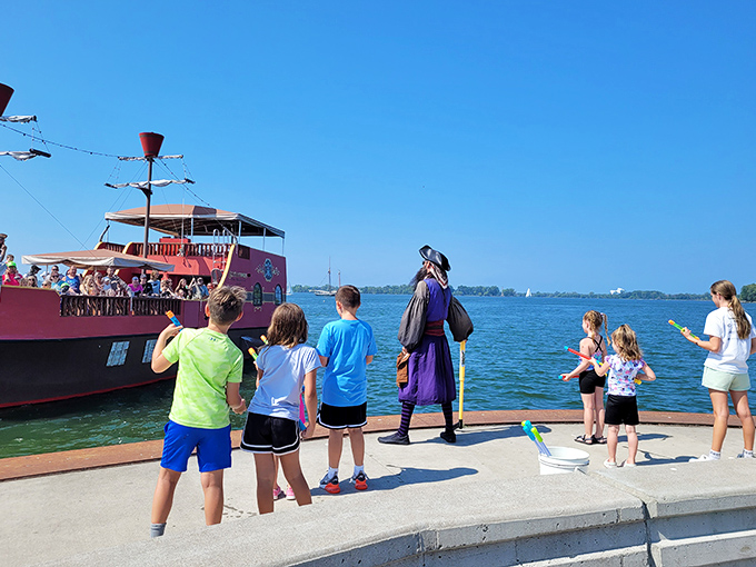 Pirates may be fictional, but the childhood wonder on these faces watching the ship is absolutely real—adventure knows no age limit here.