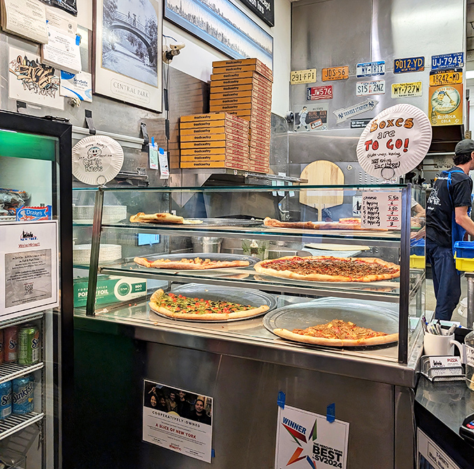 The display case of dreams showcases today's offerings. Each pie patiently waits its turn to be selected, sliced, and devoured with delight.